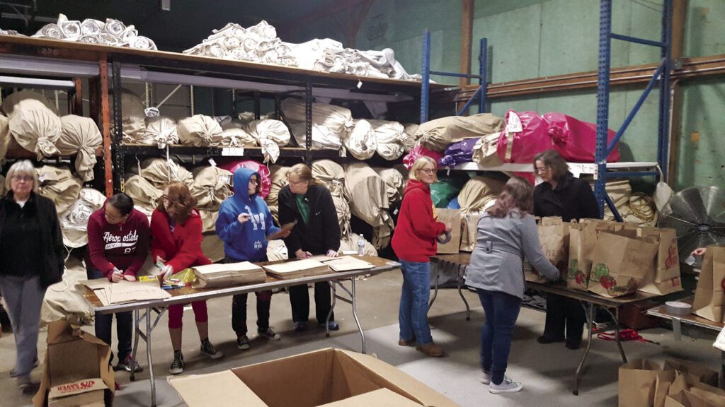 Many hands helped with luminaria fundraiser for Genesis House - Olean ...