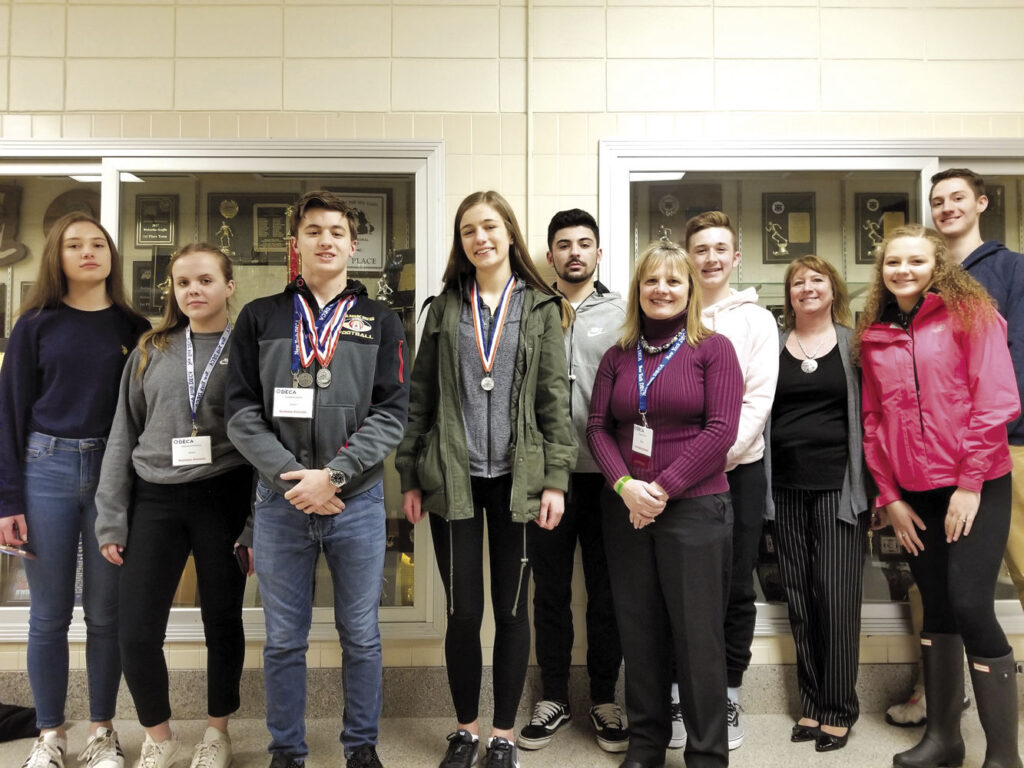 Olean High School DECA team welcomed home after successful state ...