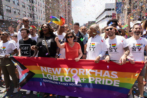LGBTQ+ Pride revelers flash feathers, flags from NY to San Francisco ...